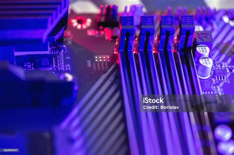 ddr4 ram closeup of empty four slots for ddr4 ram random access memory stick slots with a neon