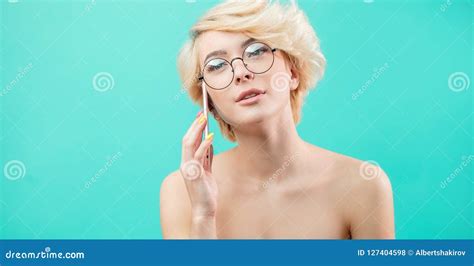Serious Naked To The Waist Girl Is Using Her Smart Phone Stock Photo Image Of Blonde Hand