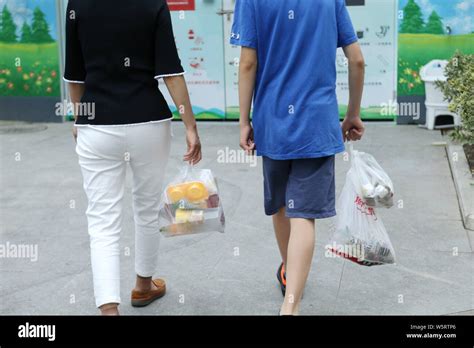 Local Residents Use QR Code Cards To Open Different Bins To Put Their Garbage At A Waste