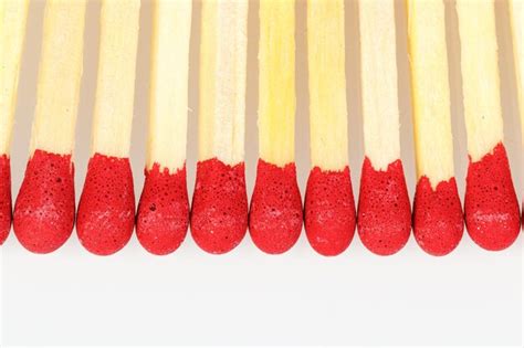 Premium Photo Matches With A Red Head On A White Background