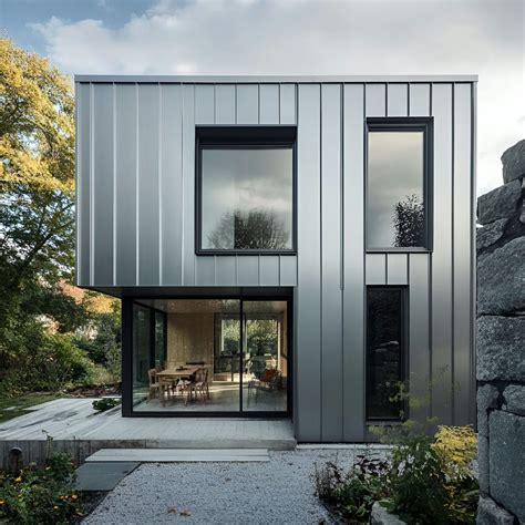 Sleek Zinc Clad Modern Home With Open Glass Walls And Natural Light