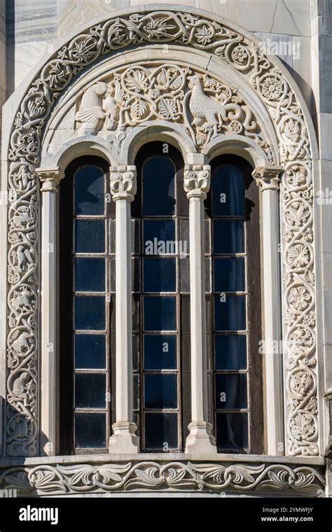 A Marble Wall With Ornamented Windows On Sunlight Of Monastery