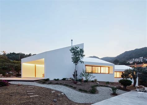 Four Angular White Volumes Form House In Mallorca By Ohlab