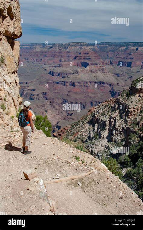 Young Woman Hiking On South Kaibab Trail In Grand Canyon National Park