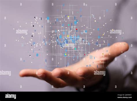 A Man Holding A Floating 3d Rendering Of Futuristic Digital Cyberspace