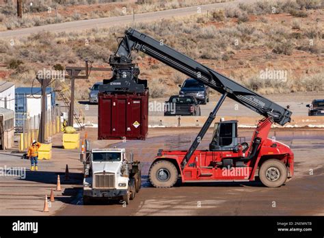 A Reachstacker Container Handler Removes A Filled And Washed Container