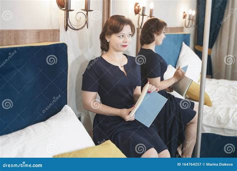 Pin Up Girl In Blue Retro Dress Reading A Book Stock Image Image Of