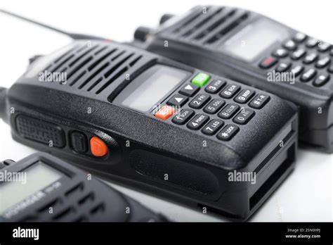 Various Models Of Handheld Communication Devices On A Clean Surface For