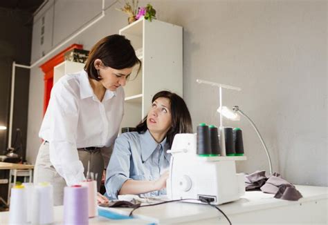 Premium Photo A Designertailor Trains A Person In Tailoring The