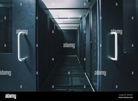 It Engineer Standing Before Working Server Rack Doing Routine Maintenance Check And Diagnostics