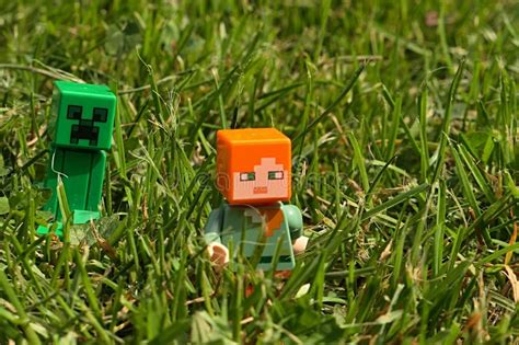 Lego Minecraft Figure Of Alex Escaping Across Freshly Mowned Garden