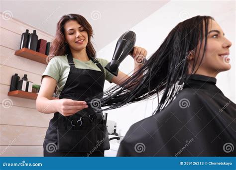 Hairdresser Drying Woman`s Hair In Beauty Salon Stock Image Image Of