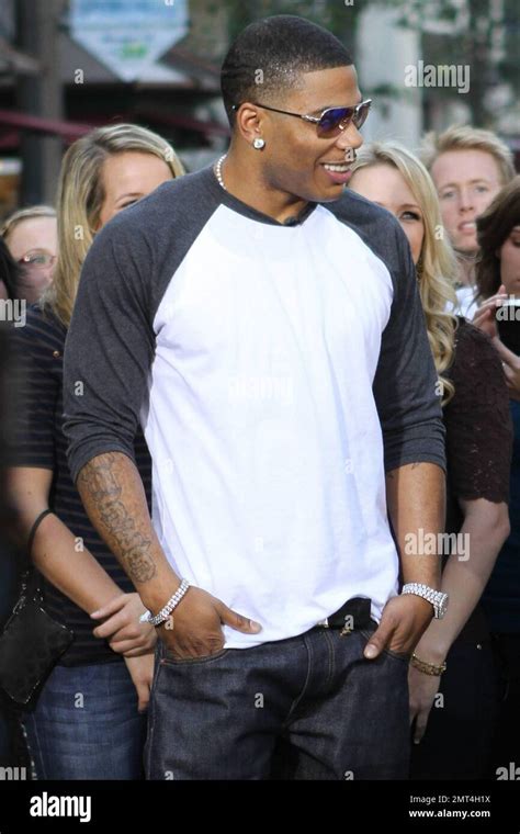Hip Hop Superstar And Actor Nelly Strolls With An Entourage At The
