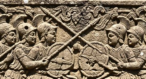 Ancient Roman Soldiers Carved In Stone Holding Spears And Shields Bas