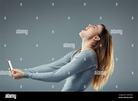 Her Fist Clenched In Fury As A Broken Smartphone And Failed Internet