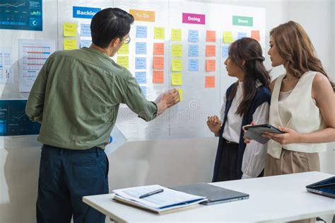 Brainstorming Session Using Sticky Notes On A Task Board Kanban To Organize Ideas And