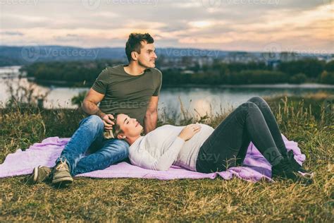 Husband And His Pregnant Wife Enjoy Spending Time Together Outdoor