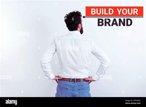 Sign Displaying Build Your Brand Word Written On Make A Commercial