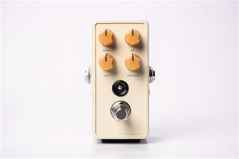 A Creamcolored Guitar Pedal With Four Knobs And A Foot Switch Isolated