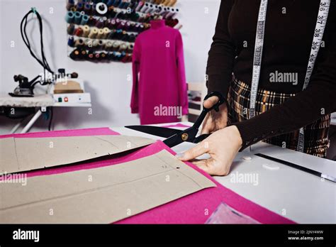 Hand Cutting Pattern And Fabric Pieces Fashion Design Female Tailor