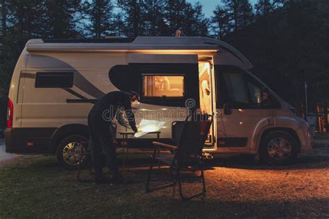 Men Browsing Local Map In Front Of His Rv Stock Image Image Of