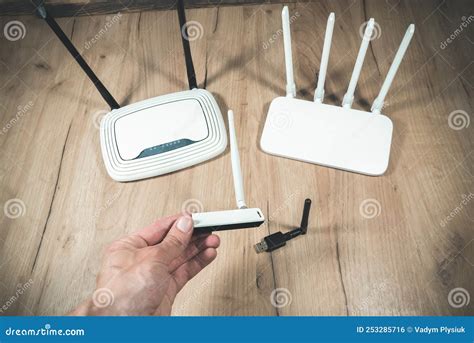 Man Choose Of Different Types Of Wi Fi Routers Modern And Old Technology Wireless Ethernet