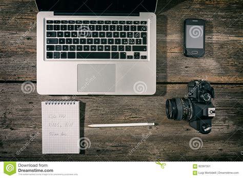 Office Workstation With Laptop Smartphone Camera Notebook And Stock