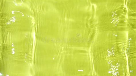 Abstract Dynamic Bright Yellow Water Surface Background Top View Stock