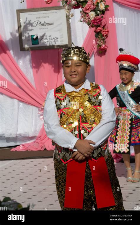 School Age Boy And Girl Model Modernized Hmong Outfits At A Fashion