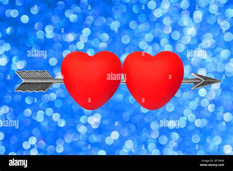 Steel Bow Arrow Passed Through Two Red Heart Shapes Isolated On A