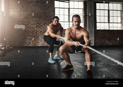 Pushing And Pulling Their Bodies To The Max Two Muscular Young Men