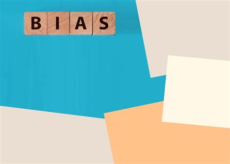 Premium Photo The Word Bias On Wooden Blocks Blue Background