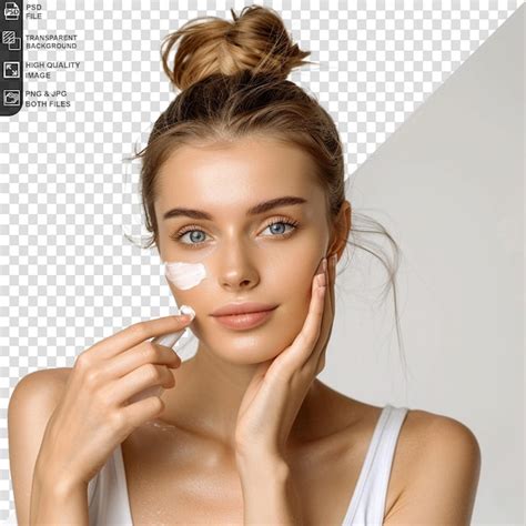 Una Hermosa Joven Aplicando Crema Facial Aislada Archivo Psd Premium