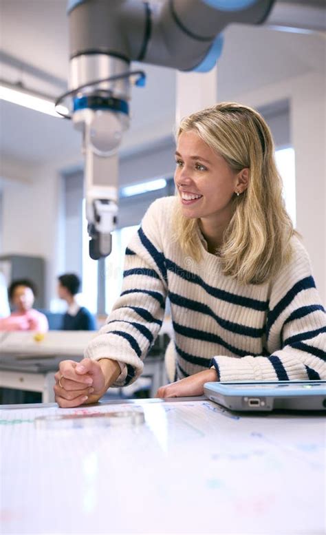 Female College Or University Engineering Student In Robotics Class