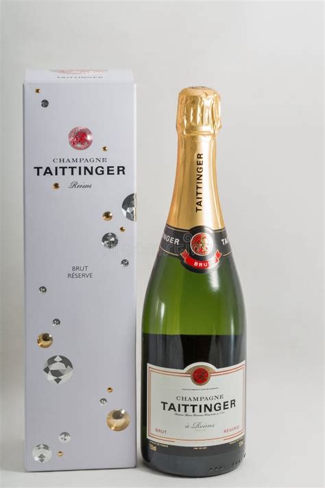 Taittinger Champagne Bottle And Box Closeup Against White Editorial