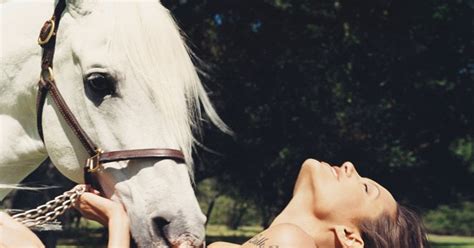 Topless Picture Of Angelina Jolie Horsing Around For Photographer David