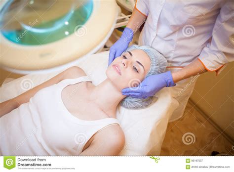 Cosmetology Doctor Makes Woman Treatments Facial Massage Stock Image