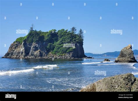 A Sea Stack Or Off Shore Island Along The Washington Coastline In The Pacific Northwest Stands