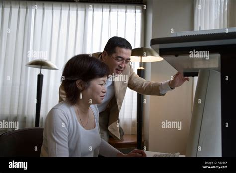 Mature Couple Using Computer Stock Photo Alamy