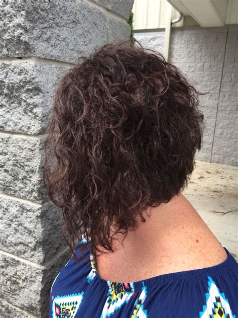 Exaggerated Angled Bob Curly Hair Curly Hair Styles Hair Salon Hair