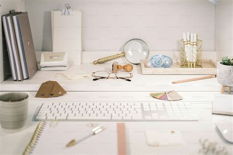 A Desk With A Keyboard Glasses Notebook And Pen Photo Keyboard Image On Unsplash