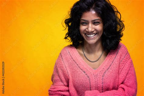 Beautiful Sri Lanka Girl Poses Standing With Yellow Bright Background