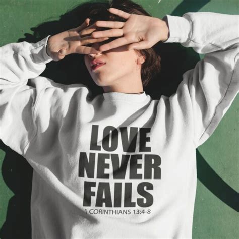 Love Never Fails Bold Christian Crewneck Sweatshirt Fabrics Of Faith