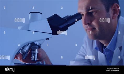 Image Of Data Processing Over Caucasian Male Scientist Using Microscope