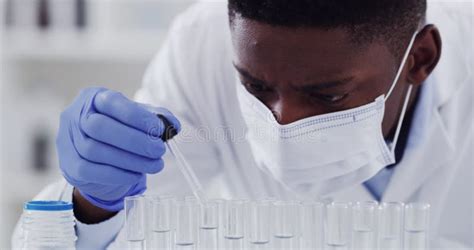 Science Microscope And Research With Man And Liquid In Laboratory For