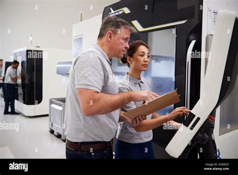 explaining colleagues foreman industrial computer colleague