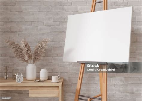 현대적이고 아늑한 방에서 나무 이젤에 빈 수평 캔버스 캔버스 모형 스칸디나비아 인테리어 보호 스타일 무료 사진을위한 공간을 복사하십시오 아트웍 프레젠테이션 3d 렌더링