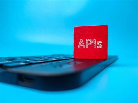 Premium Photo Red Block And Black Keyboard With The Word Apis On Blue