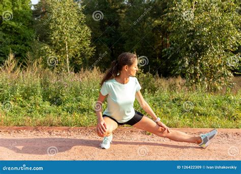 Slim Young Girl Stretching Her Legs Outdoors Stock Image Image Of