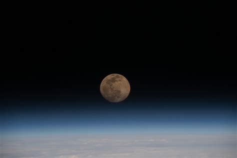Moon Pictures A Full Moon Above The Earths Horizon